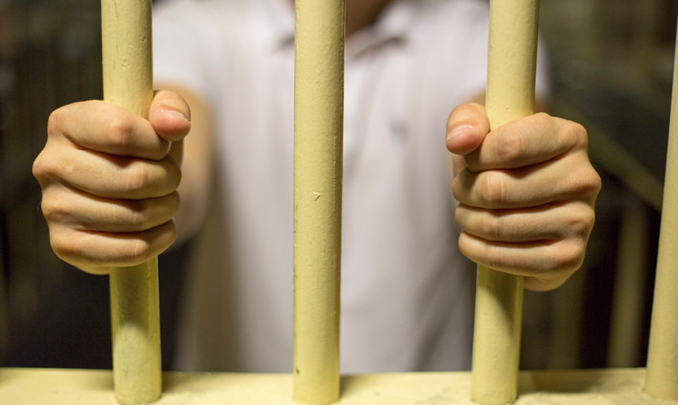 hands-on-jail-bars | Sobering Up